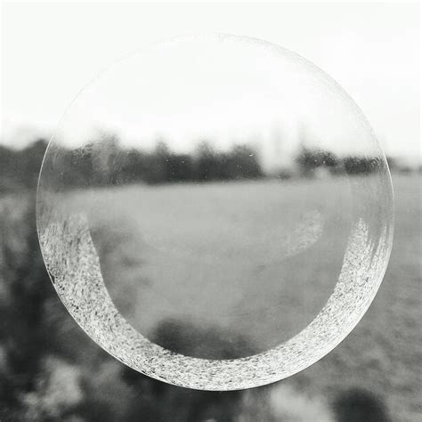 Premium Photo Close Up Of Bubble Against Field