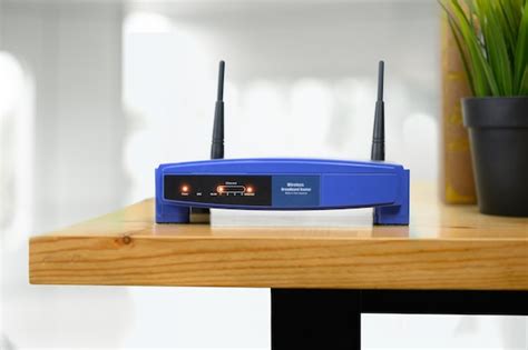 Premium Photo Closeup Of A Wireless Router And A Man Using Smartphone On Living Room At Home