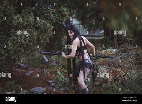 Beautiful Brunette Girl From A Tribe With A Spear Stock Photo Alamy