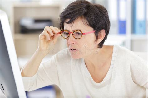 female office worker looking at computer screen stock image image of lifestyle saucer 269813047