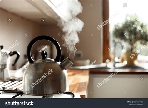 Tea Kettle With Boiling Water Over 14241 Royalty Free Licensable