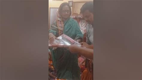 দূর্গাপূজা উপলক্ষে আশ্রমের বস্ত্র বিতরণ করা হচ্ছে। Youtube