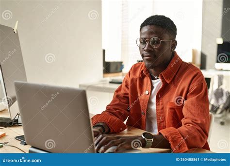 Young African American It Engineer Or Webdesigner Looking At Laptop Screen Stock Image Image