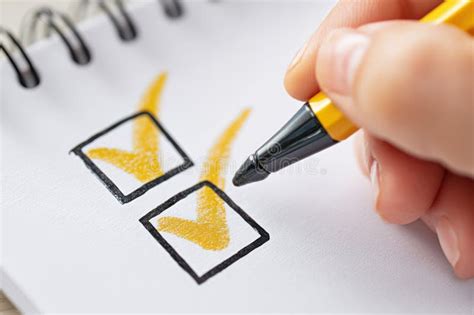 Hand Drawing Checkmark In Checkbox On Notepad Using Yellow Marker Stock