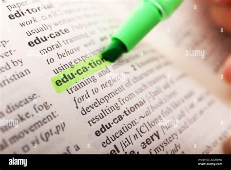 Green Marker Highlighting Word In Dictionary Stock Photo Alamy