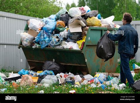 Man Throwing Garbage In Bin Hi Res Stock Photography And Images Alamy