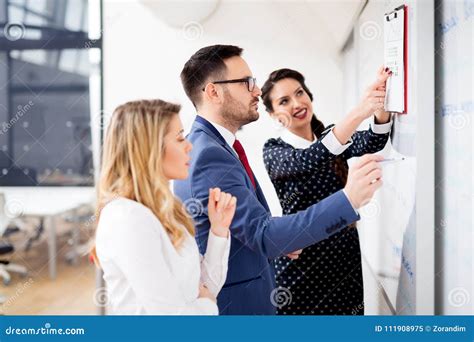 Young Businessman Making Presentation And Showing Diagram On Whiteboard Stock Image Image Of