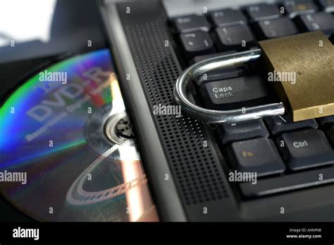Open Padlock Around Caps Lock Key On Laptop Keyboard With Disc Stock Photo Alamy