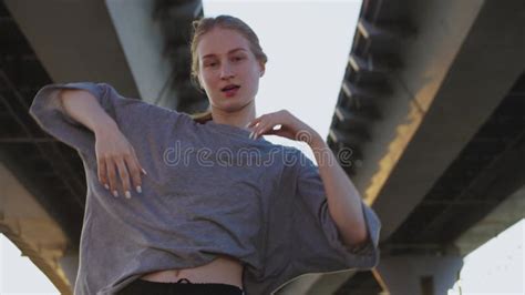Skinny Pretty Woman With Long Light Hair Dancing Under The Bridge Stock