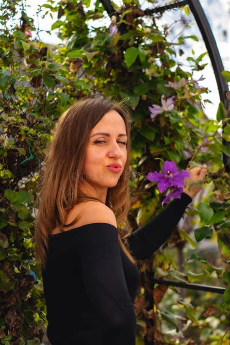 A Charming Woman And A Climatis Flower Stock Image Image Of Climatis