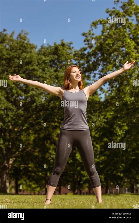 Pretty Redhead Smiling At Sunlight Stock Photo Alamy