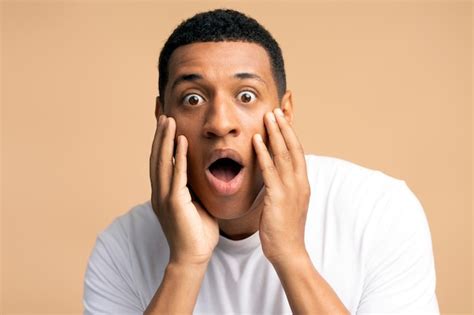 Premium Photo Latin Man Looking With Big Eyes Scared Surprised Expression Shocked By Sudden News