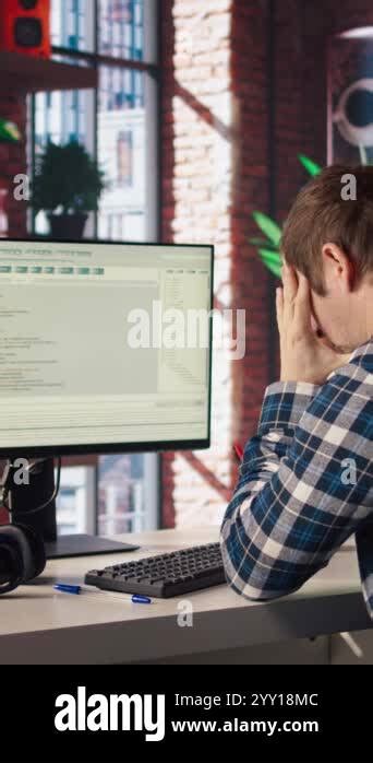 Software Developer At Computer Waiting For Code To Finish Compiling Yawning Feeling Bored
