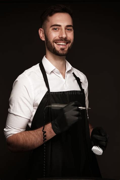 Manicur Master Man In Working Form With Tools In Hand Nail Photo