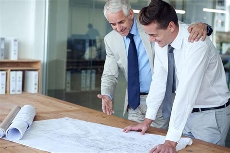 Premium Photo Architect Collaboration And Blueprint With Men In Office For Planning