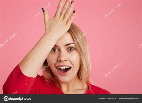 Forgetful Female Model Remembers Something After Long Time Keeps Hand