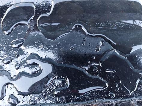 Premium Photo Spraying Liquid Bituminous Mastic On The Concrete Foundation For The Insulation