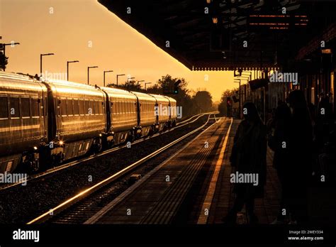 Rising Sun Glinting Off A Chiltern Railways Mainline Mk3 Train At Bicester North Railway Station
