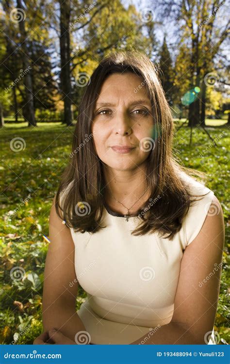 Mature Real Brunette Woman In Green Spring Park Lifestyle Concept