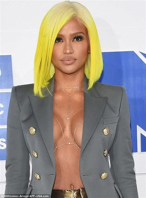 Nicki Mina At The American Music Awards Wearing A Grey Blazer And Gold