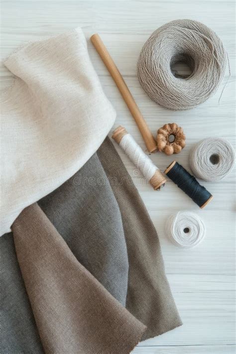 Artfully Arranged Soft Fabrics And Threads On Wood For Textile Design Inspiration Stock Image