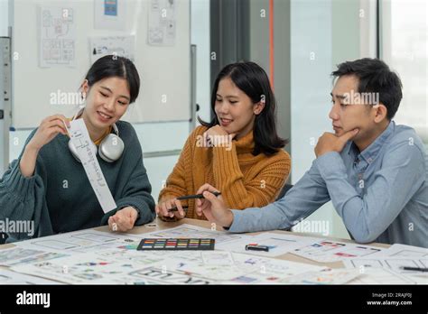 Creative Designer Choosing Color Samples For Mobile Responsive Website Development With Ui Ux