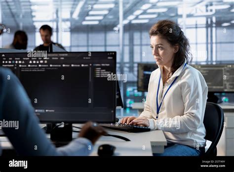 programmer at work implementing cybersecurity measures to protect data
