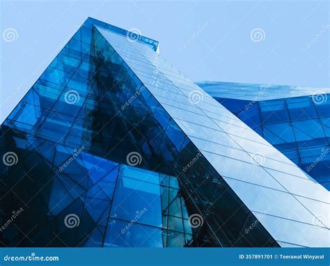 Glass Facade Of A Modern Building The Sky Reflected In The Windows Of An Office Building