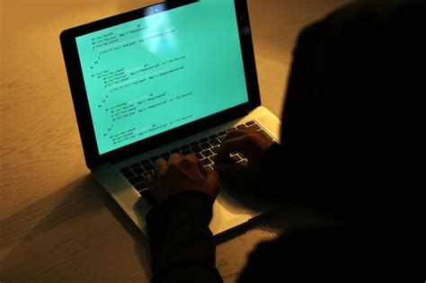 Premium Photo Hacker With Laptop