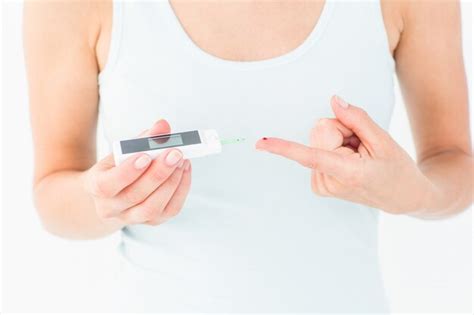 Premium Photo Woman Testing Her Blood Glucose Level