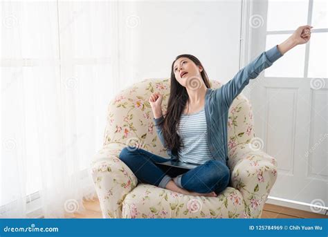Girl Stretching Body And Sitting On Sofa Stock Image Image Of Comfort