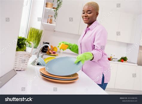 Girl Washing The Dishes