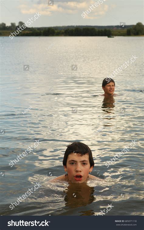 Boy Swimming In Lake