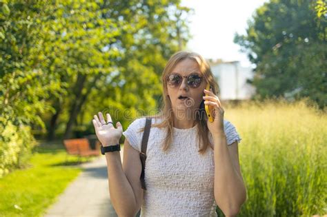 Surprised Young Female Blogger Chatting With Best Friends In Social