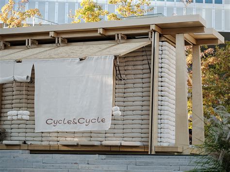 F O G Fronts Cycle Cycle Mobile Bakehouse With Piles Of Grain Sacks