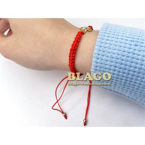 Браслет на руку плетений червоний з хрестиком