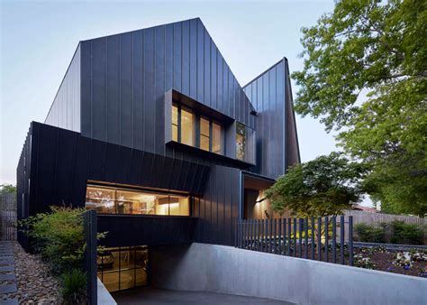 House By Inarc Features A Spiked Entrance And A Car Turntable