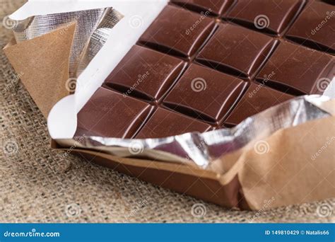 Close Up Part Of Chocolate In Opened Wrapper On Burlap Stock Image Image Of Snack Opened
