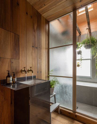 Smoked Oak And Rustic Clay Line Walls Of Japanese Styled Apartment