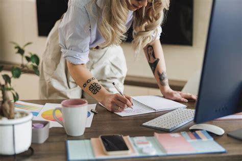 Premium Photo Close Up Of An Unrecognizable Young Web Female Developer Taking Notes While