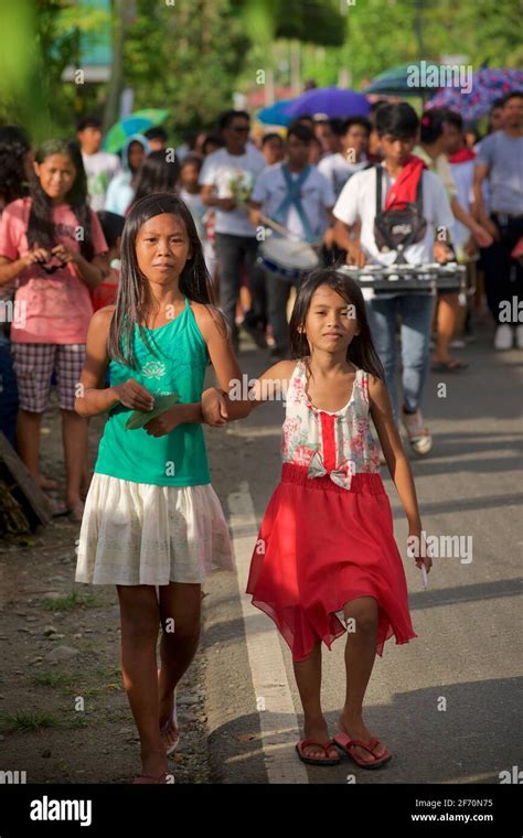 Filipina Girls Walking In A Procession For Flores De Mayo Celebrations