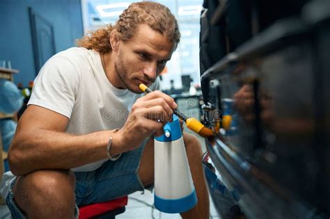 Man Cleans Car Grilles With A Brush And Spray Bottle Stock Image Image Of Workshop Profession