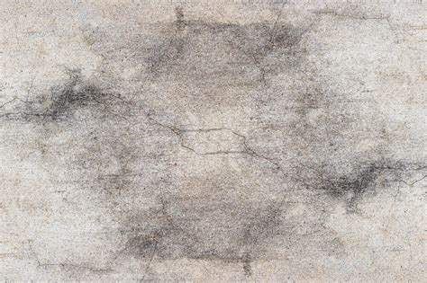 질감과 균열이 있는 매끄러운 회색 시멘트 석고 배경 프리미엄 사진