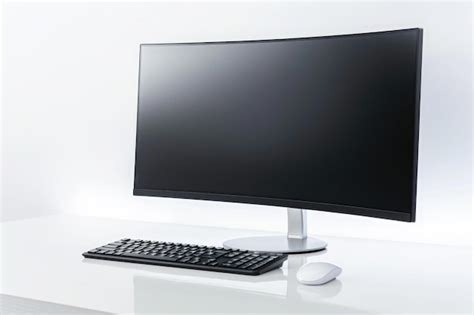 A Sleek Modern Curved Monitor And Minimalist Keyboard Enhancing Productivity In A Contemporary
