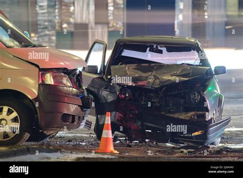 cars crashed heavily in road accident after collision on city street at night road safety and