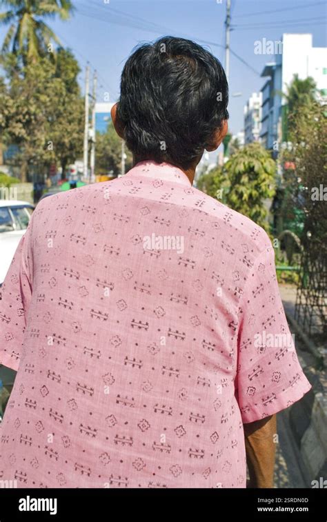 Cycle Rickshaw Driver In Pink Shirt On Cycle Rickshaw New Market
