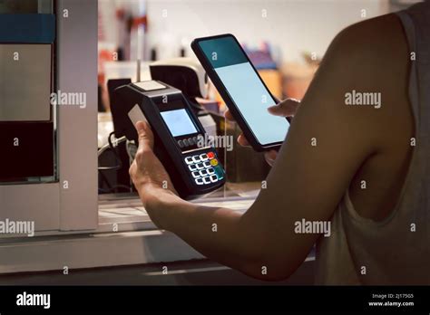 Woman Customer Scanning QR Code On Terminal Payment To Pay Bill With Smart Phone Stock Photo Alamy