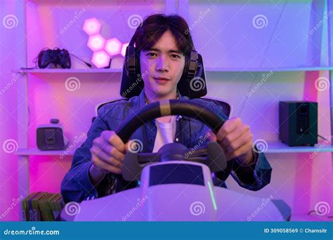 Male Esport Gamer With Car Steering Wheel Joy Controller Playing