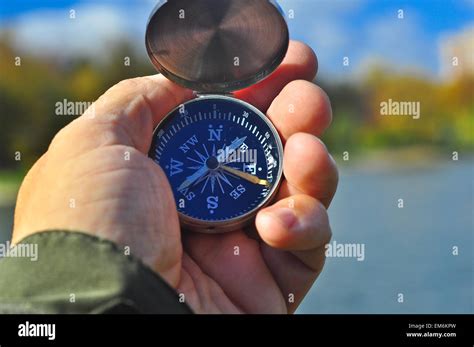 Compass In Hand Magnetic Compass In Hand On The Autumn Landscape Stock