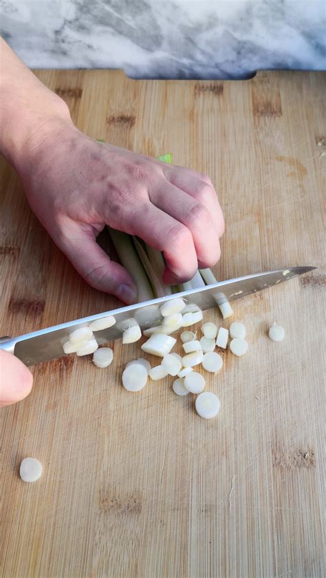 Finely Slicing Spring Onion With A Large Knife
